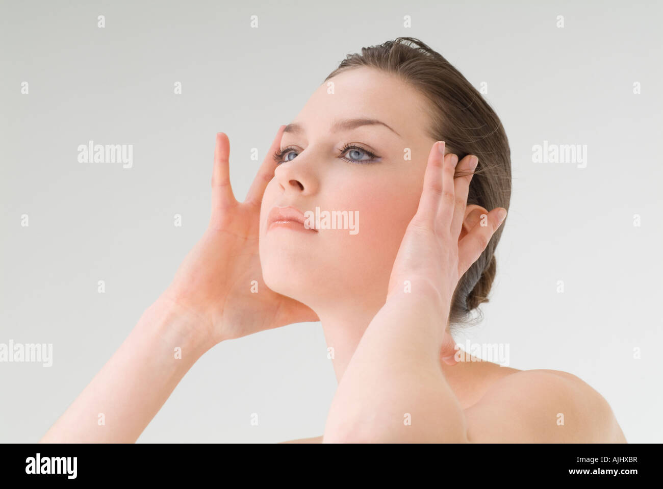 Young woman massaging temples Stock Photo - Alamy