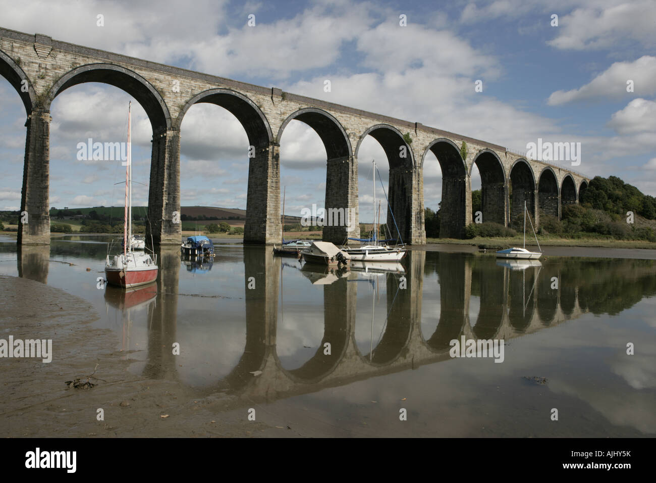 The rail viaduct over the boats on the estuary of the River Lynher at ...