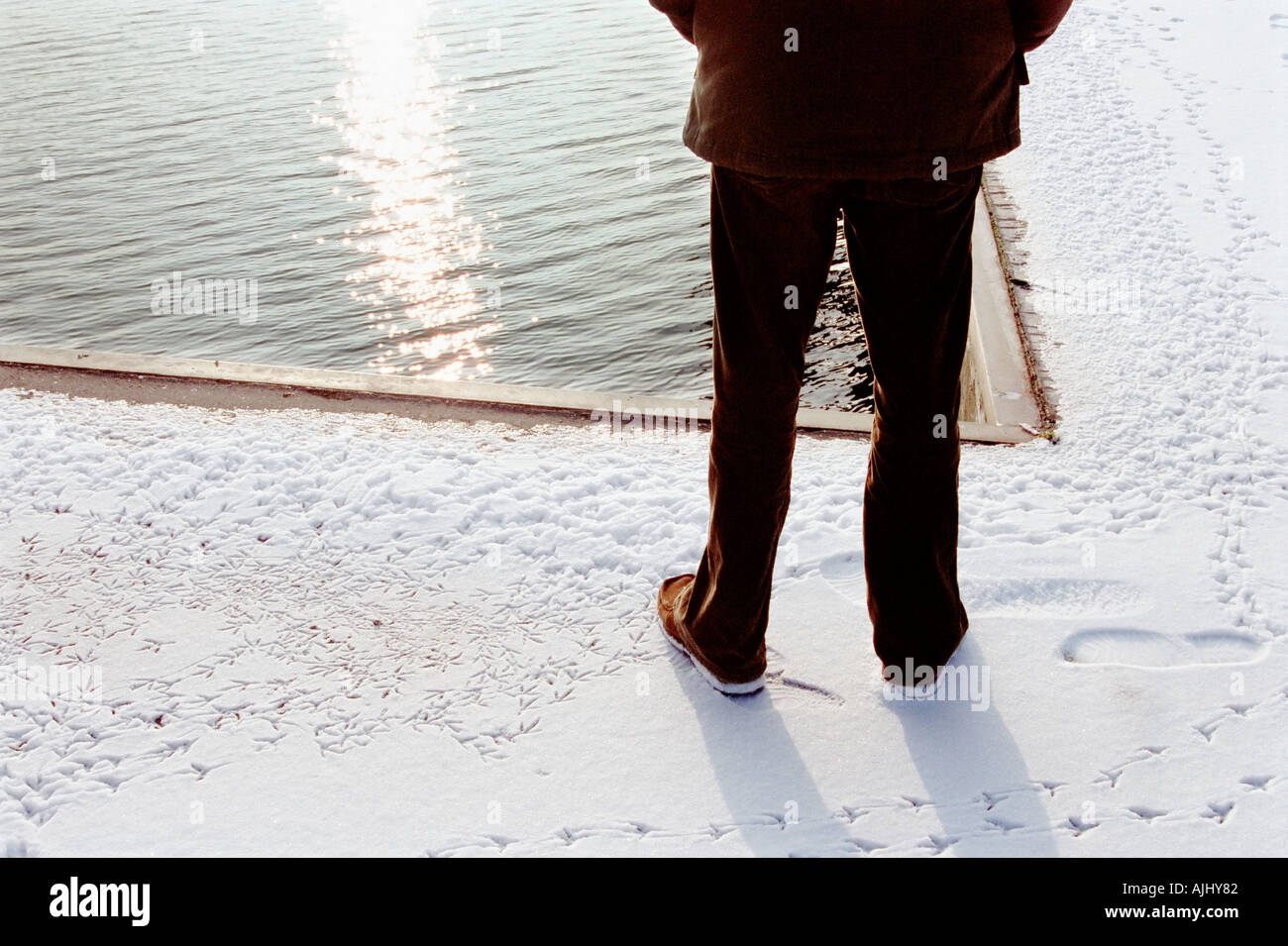 Man standing near sea Stock Photo - Alamy