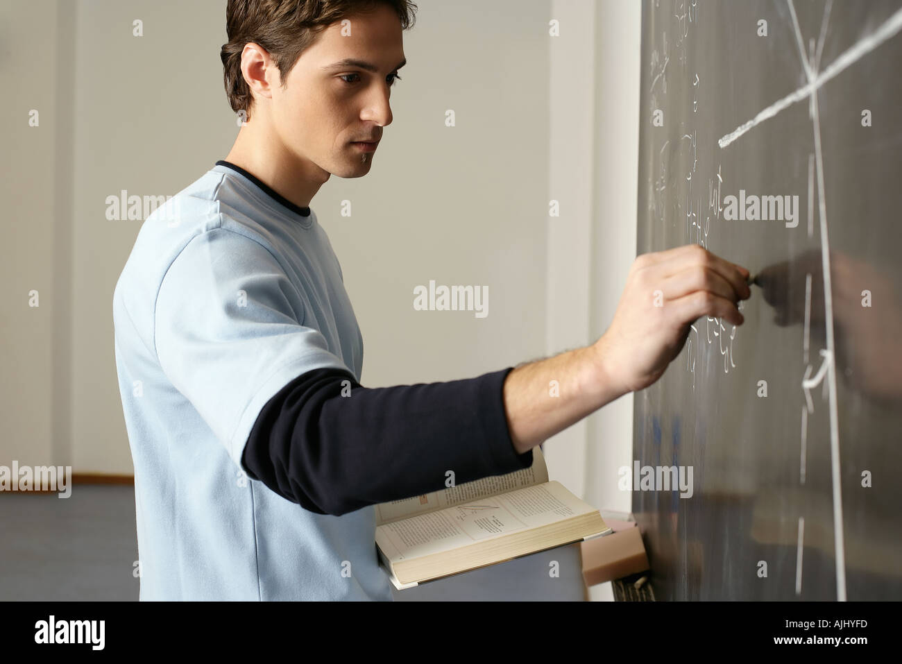 Student working on maths problem Stock Photo - Alamy