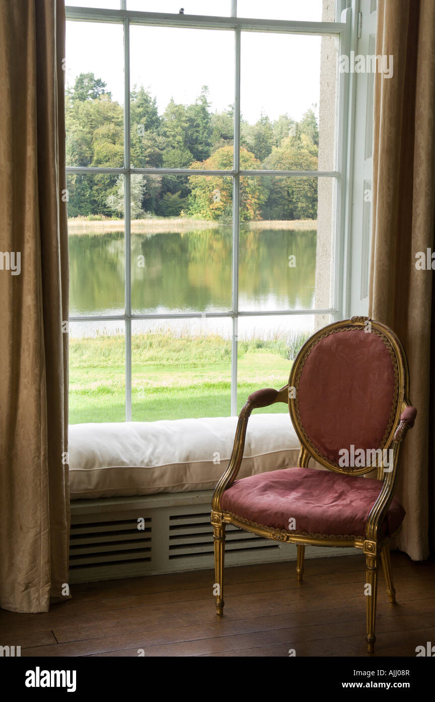 Louis XVI chair in front of a window with seat in 17th century Irish ...