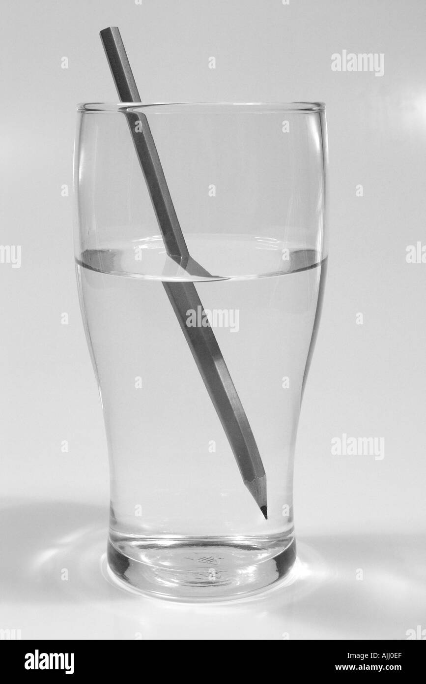 Diffraction of Pencil in Glass of Water Stock Photo - Alamy