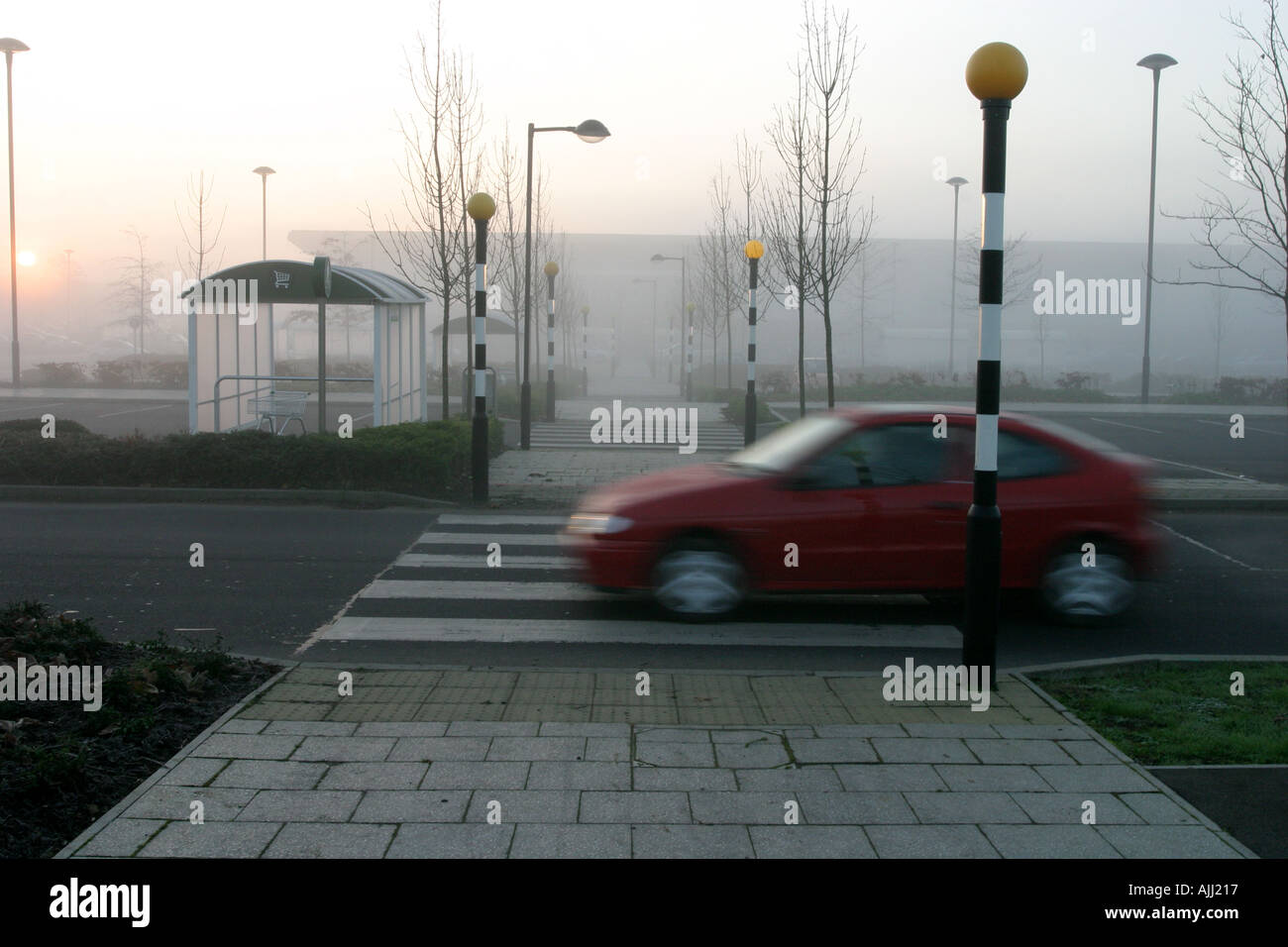 A speeding vehicle drives over a zebra crossing in a supermarket car ...