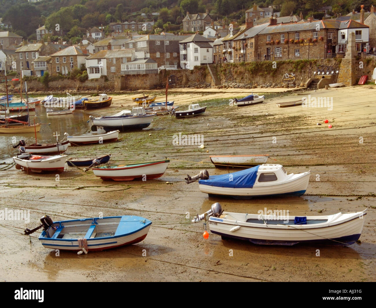 Boats at low water Mousehole Harbour Mousehole Cornwall England United ...