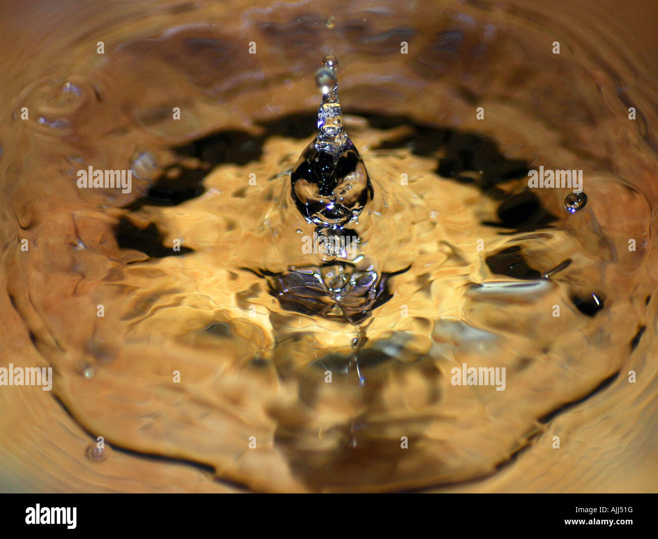Water drops splash in liquid Stock Photo - Alamy