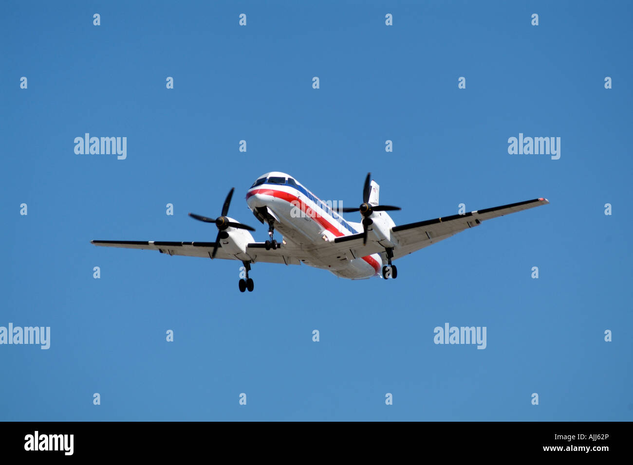 American Eagle Jet Prop Commuter Aircraft on Finals to Land On an ...