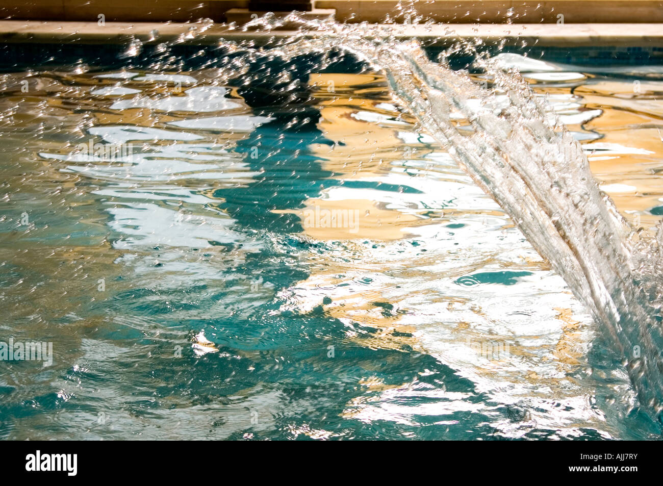 Water splashing on swimming pool surface Stock Photo - Alamy