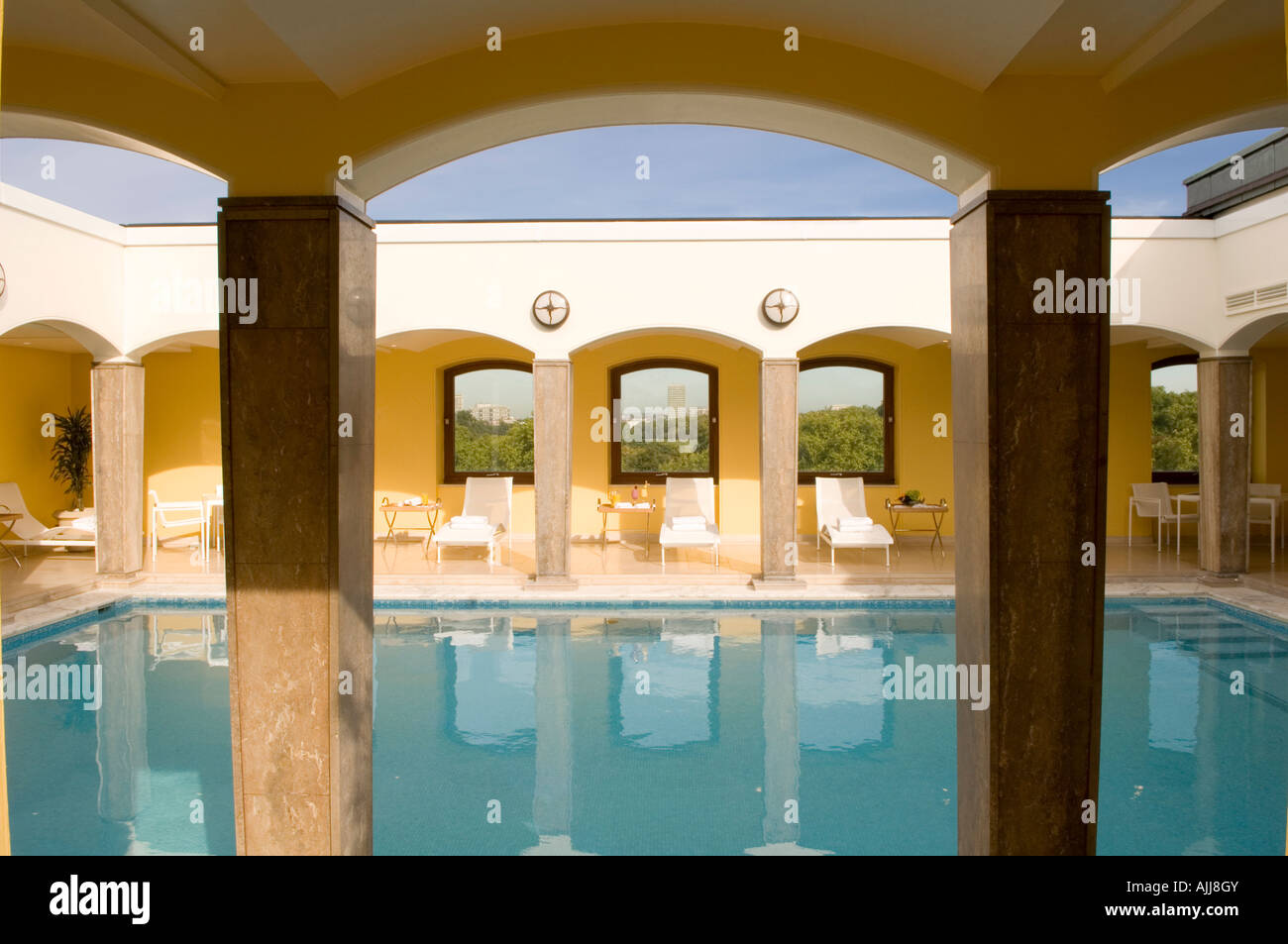 Outdoor swimming pool with colonnades and sun loungers at the Berkeley ...