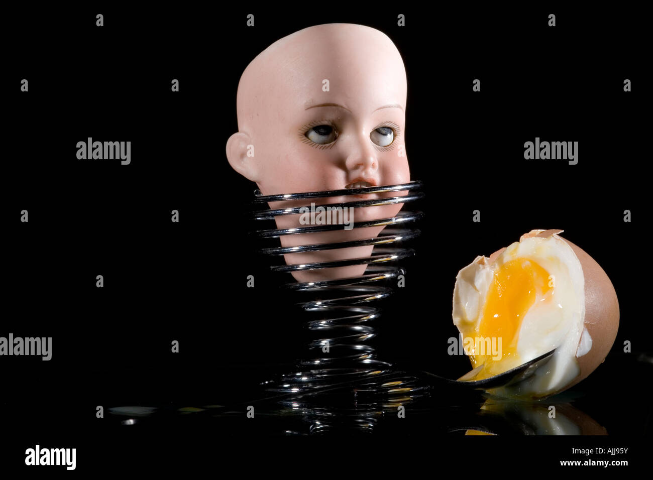 head in egg cup with boiled egg Stock Photo - Alamy
