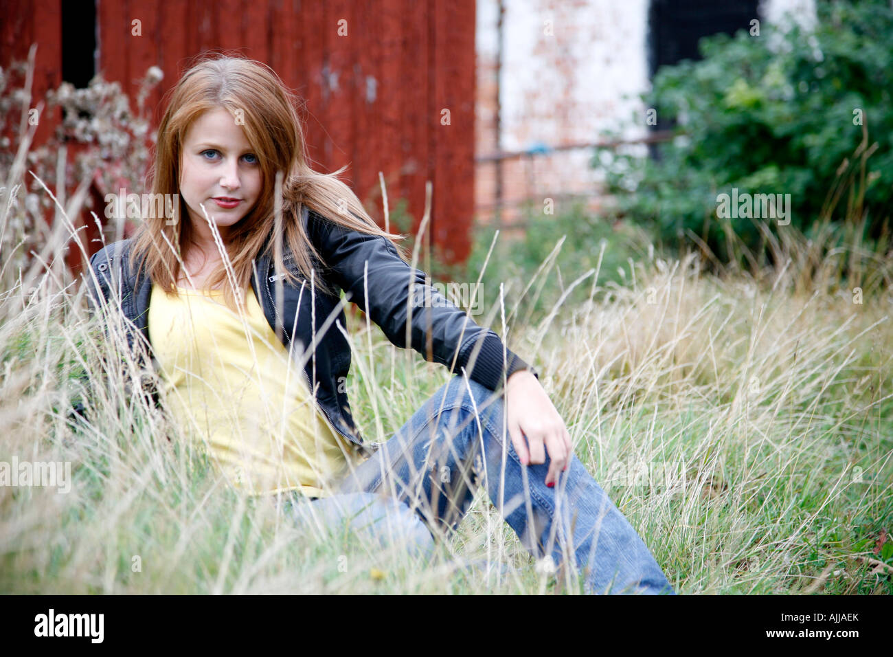 Young Girl, Sat on Grass Stock Photo - Alamy