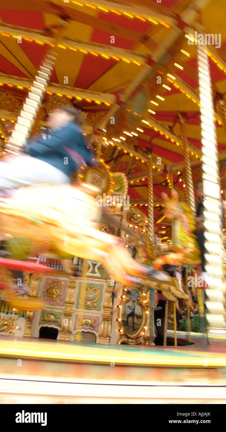 Carousel Merry go round blurr Stock Photo - Alamy