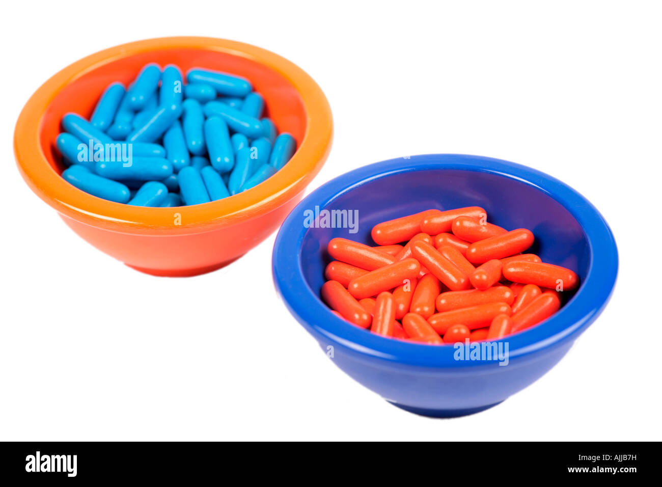 orange and blue bowls with sweets Stock Photo - Alamy