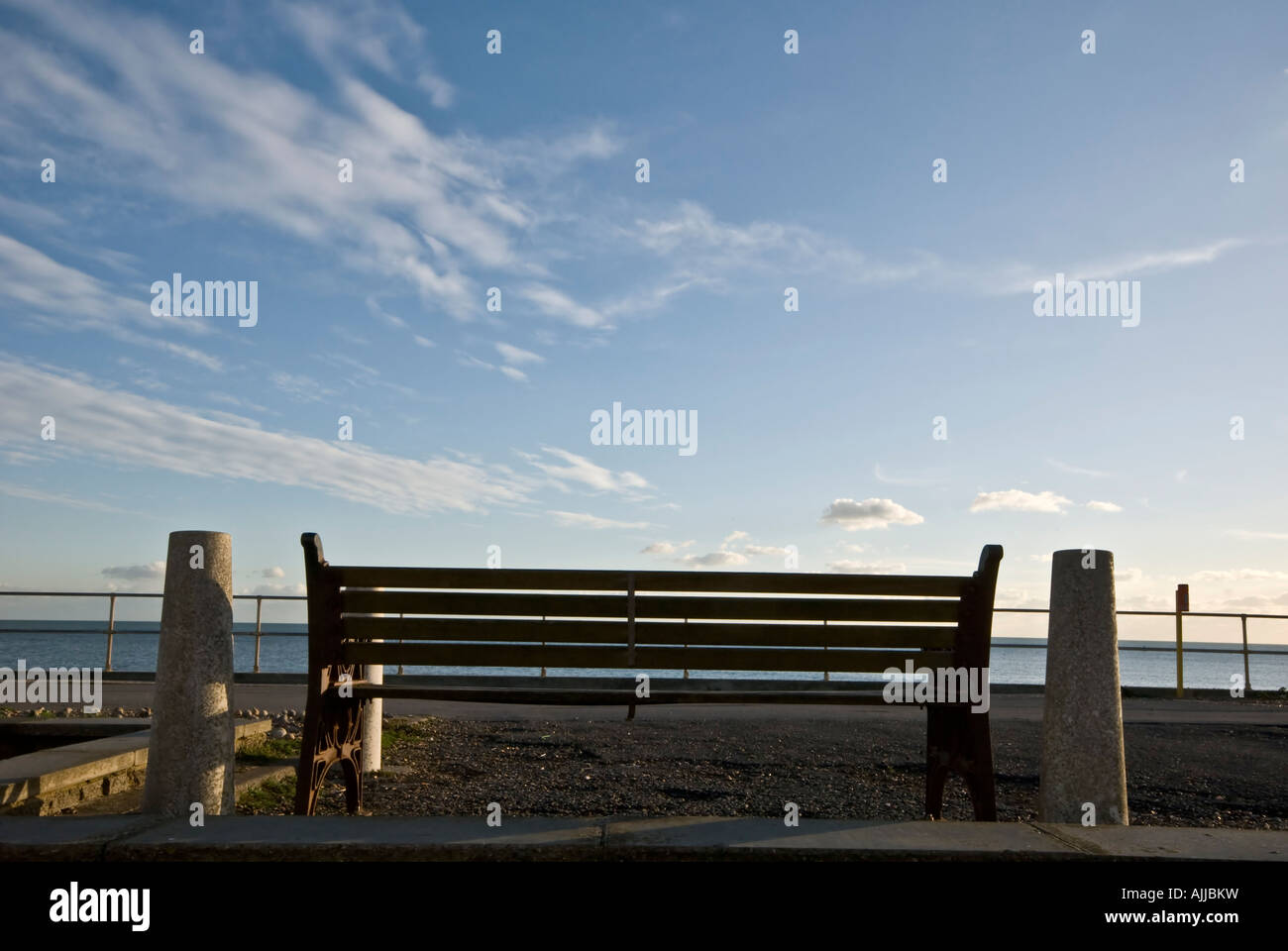 Empty bench seaside sky sea Stock Photo - Alamy