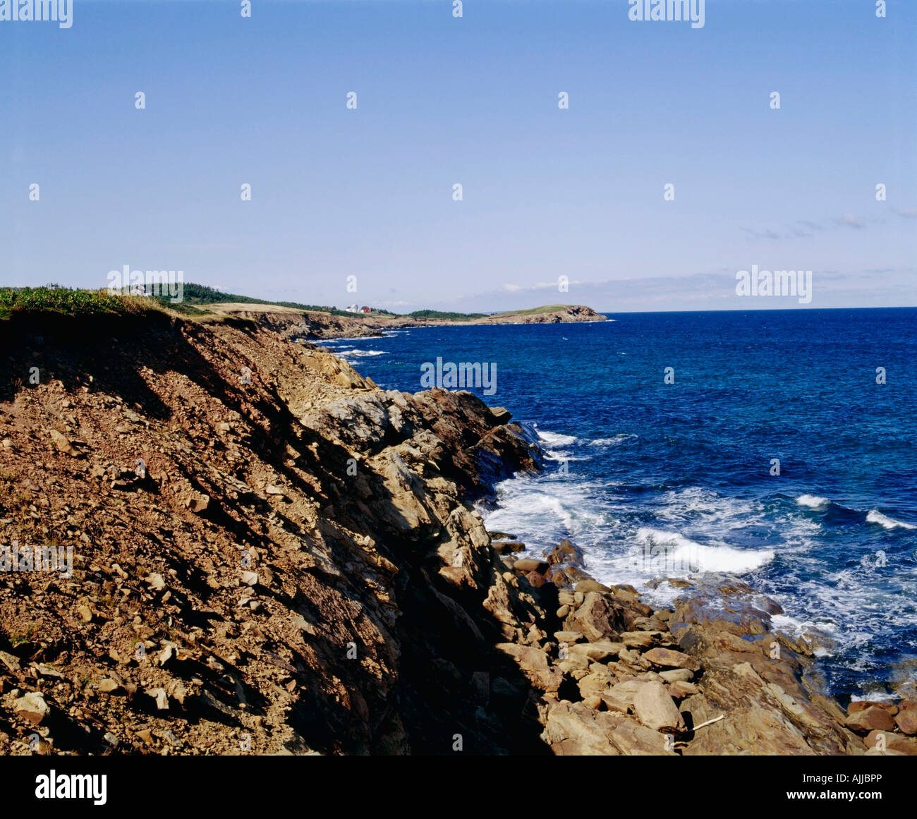 Waves crashing on rocky shore Stock Photo - Alamy