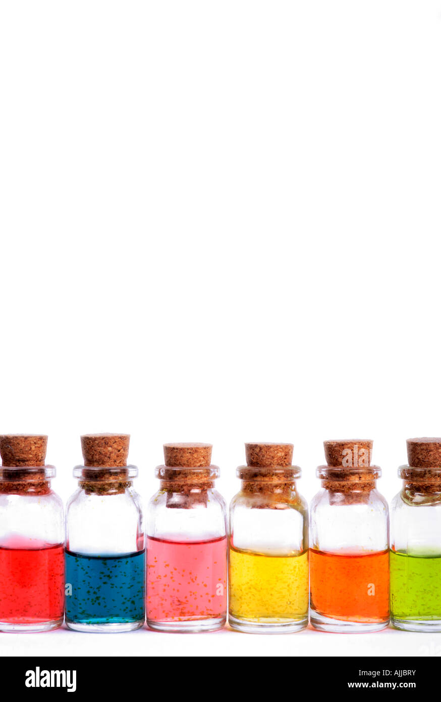 Coloured liquid in small glass jars Stock Photo - Alamy