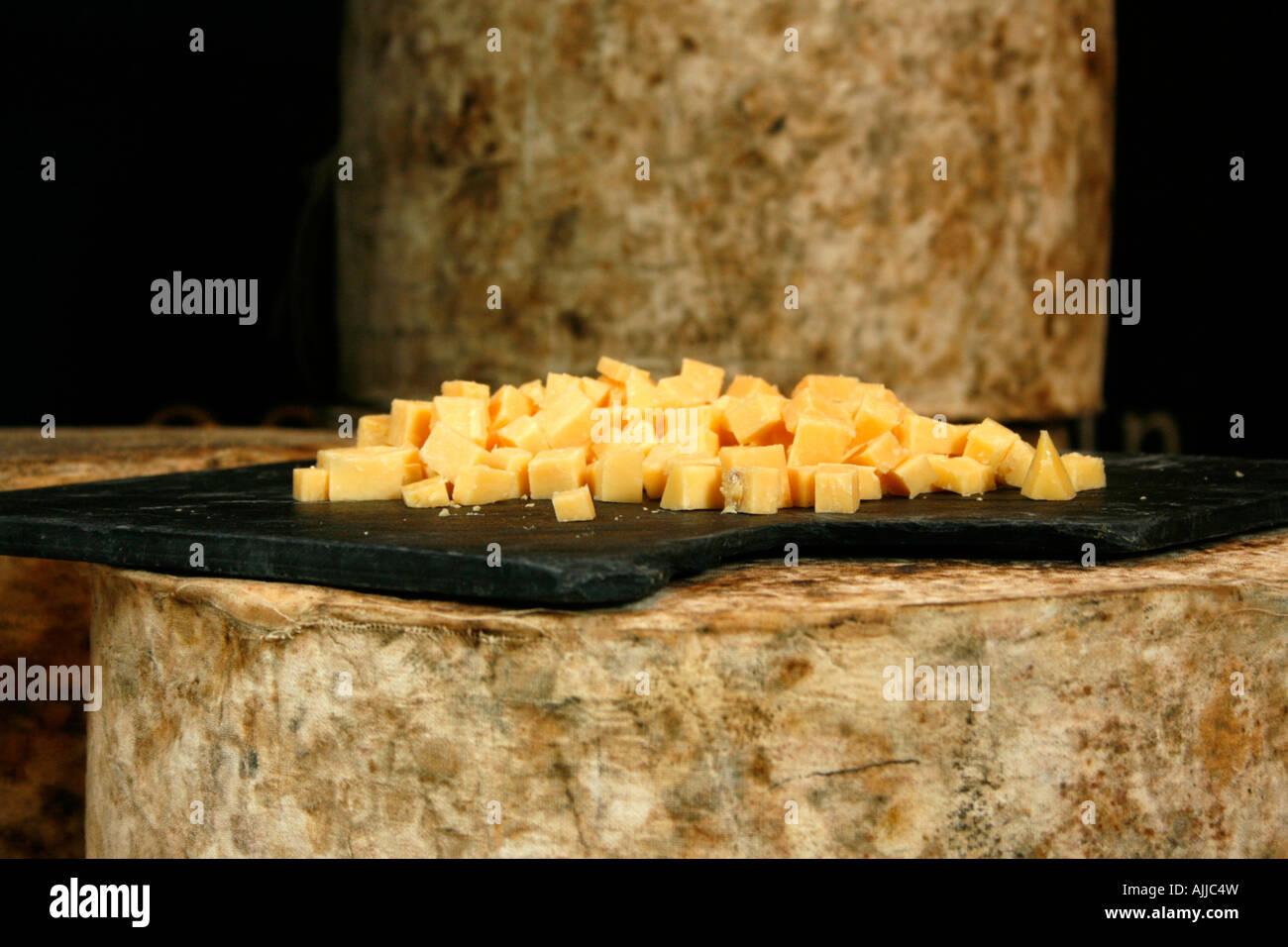 cheese rounds and samples cheeseboard Stock Photo - Alamy