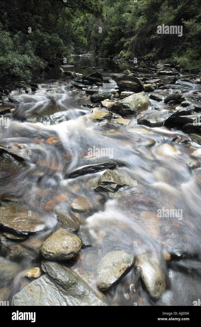 Water flowing over rocks in river Stock Photo - Alamy