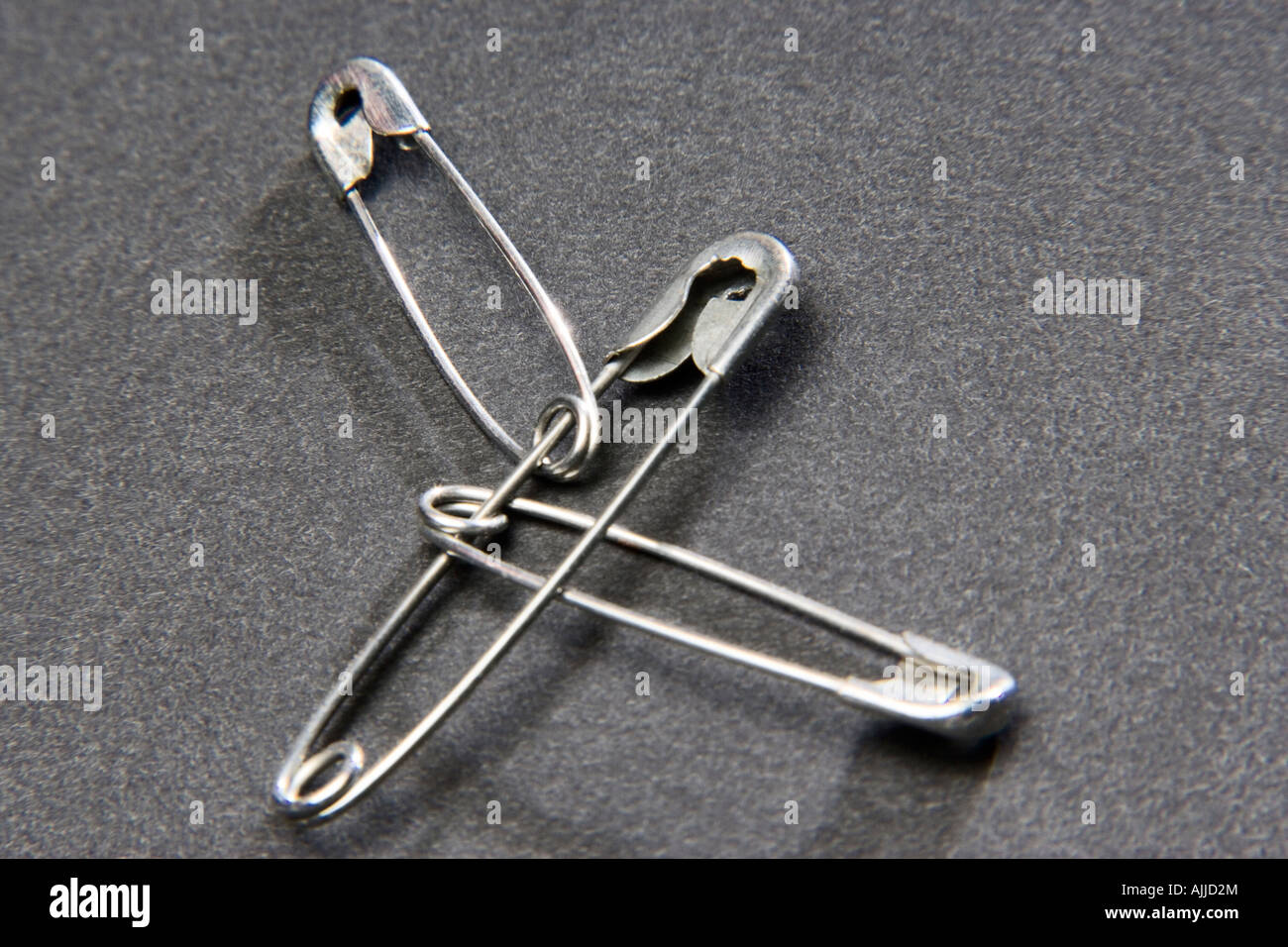 Three safety pins Stock Photo - Alamy