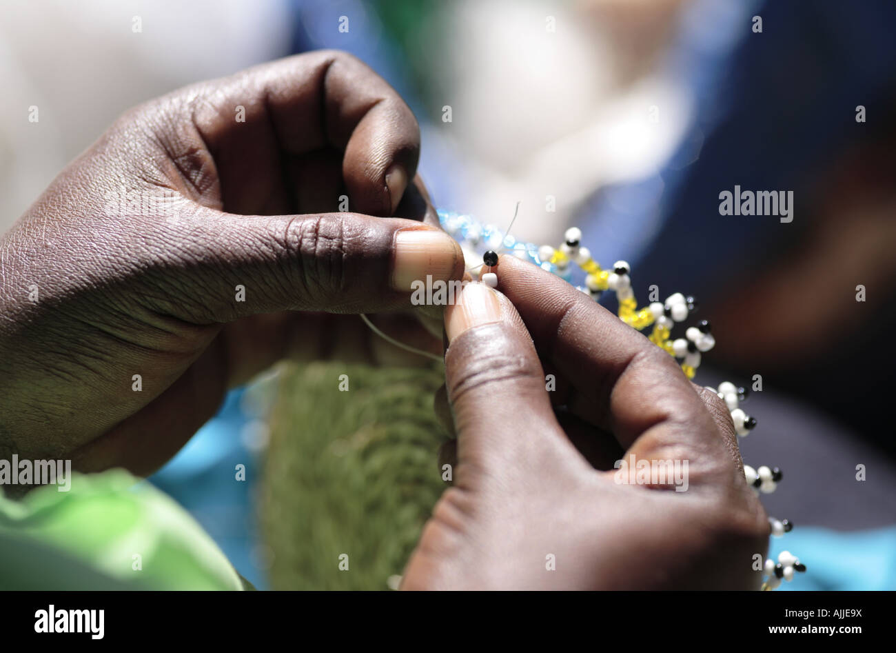 Woman making bead necklace Stock Photo - Alamy