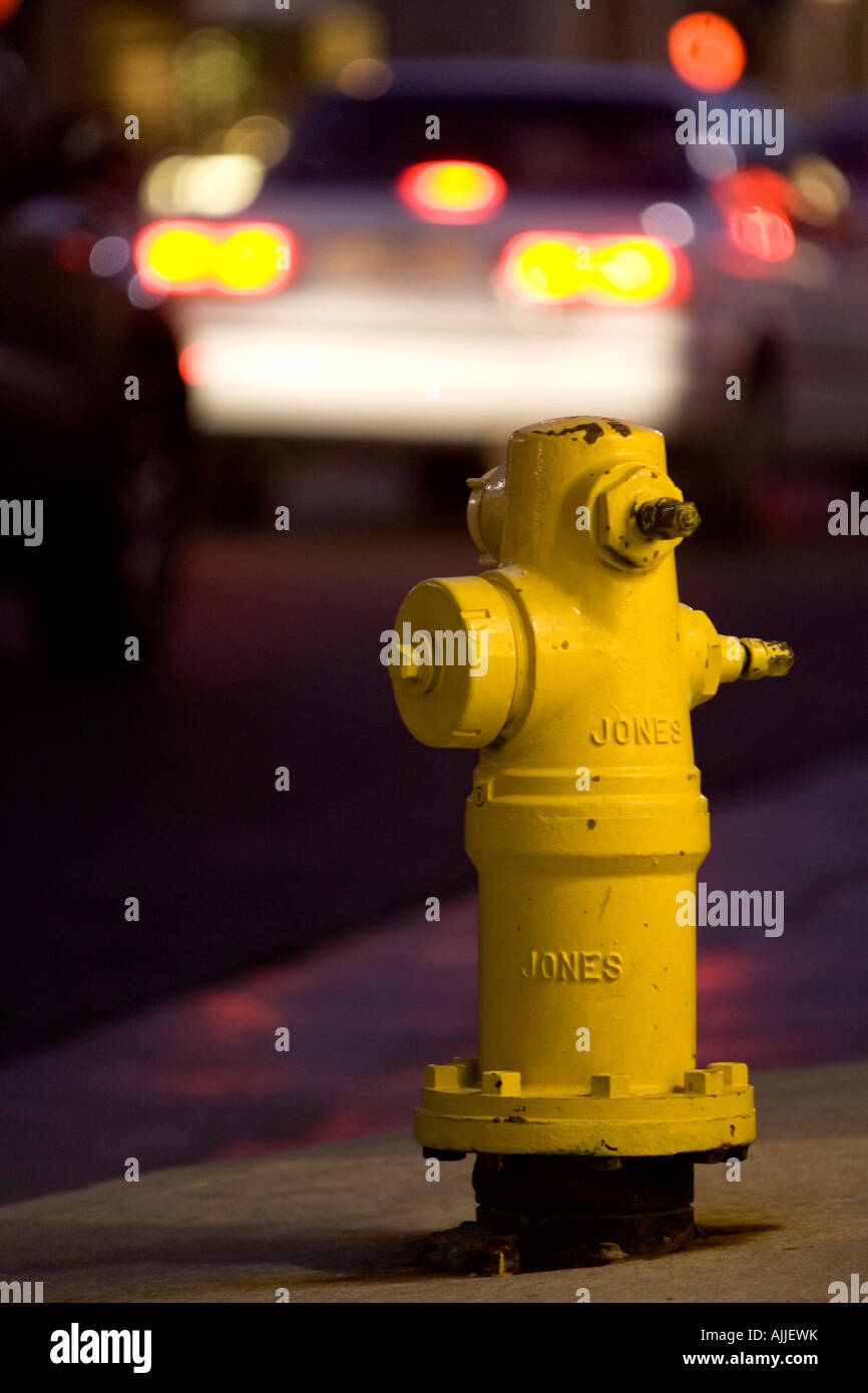 Yellow American Jones water fire hydrant on busy street corner in ...