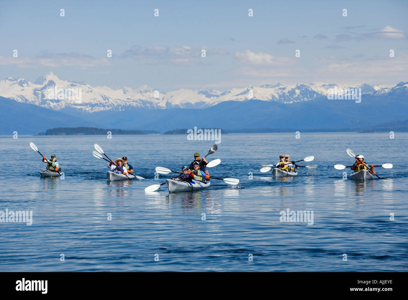 Multiple friends kayaking together in Frederick Sound Inside Passage ...