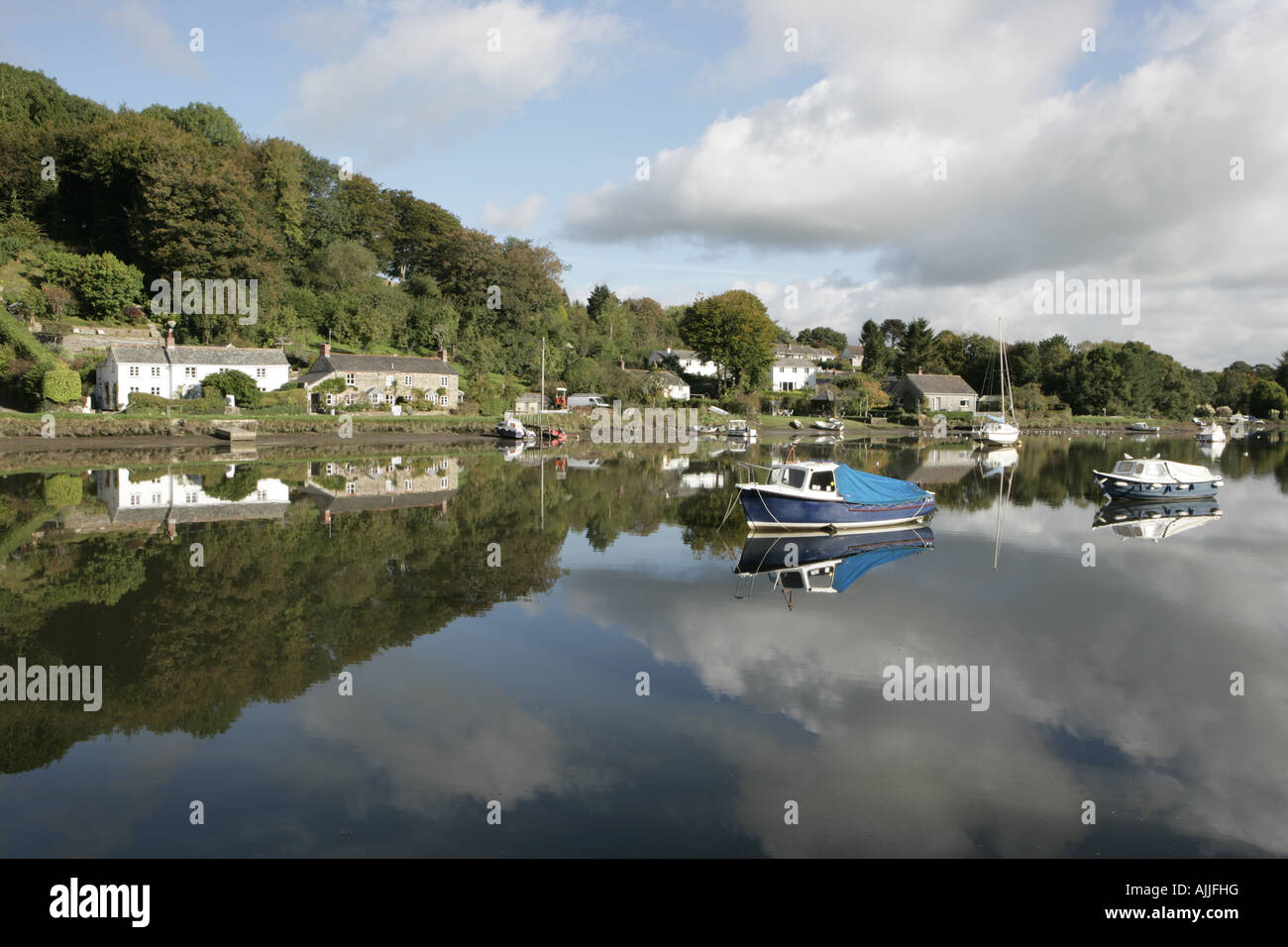 Late summer with still water on the river at cornish village of Lerryn ...