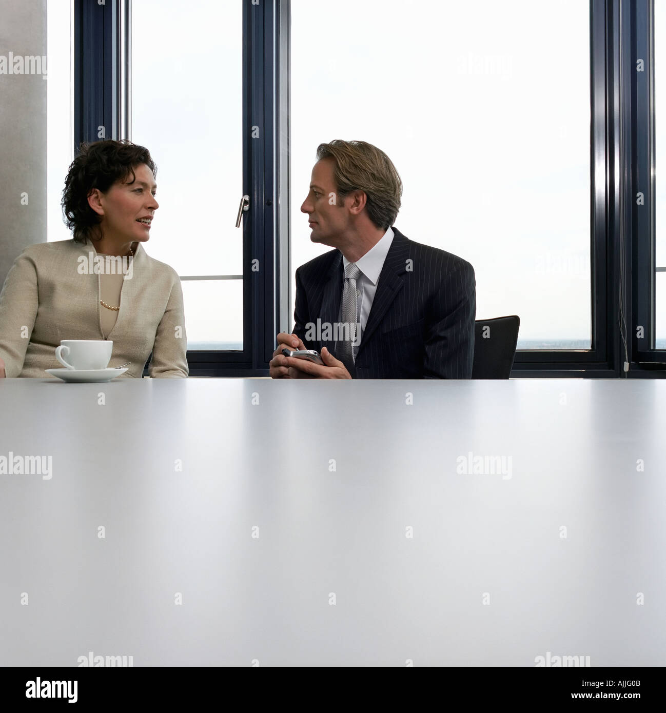 Two business people in conversation Stock Photo - Alamy
