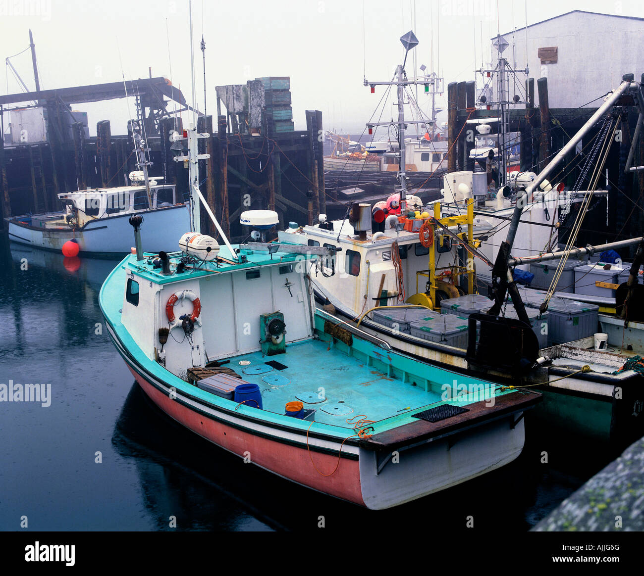 Fishing boats in a harbour Stock Photo - Alamy