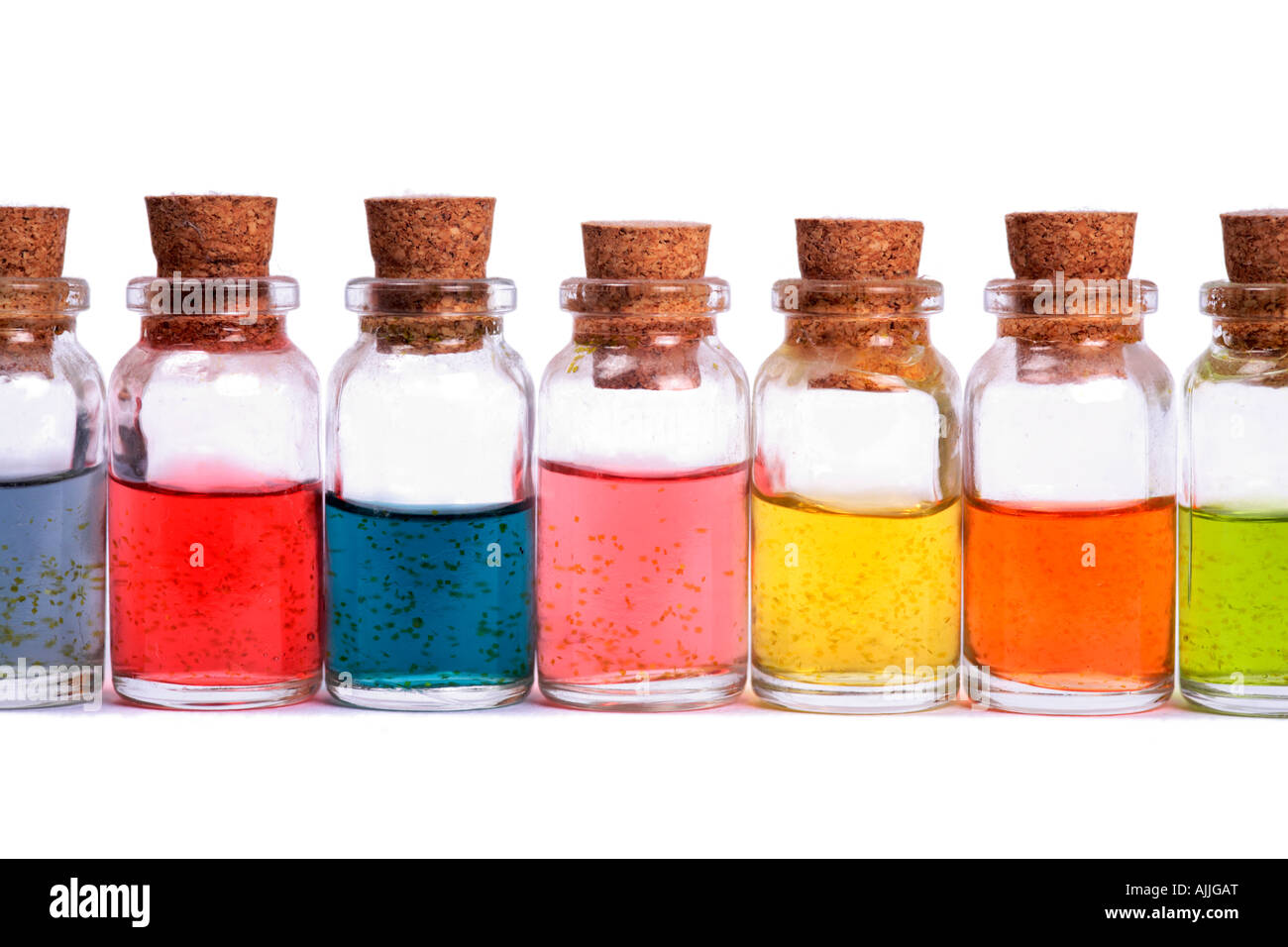 Coloured liquid in small glass jars Stock Photo - Alamy