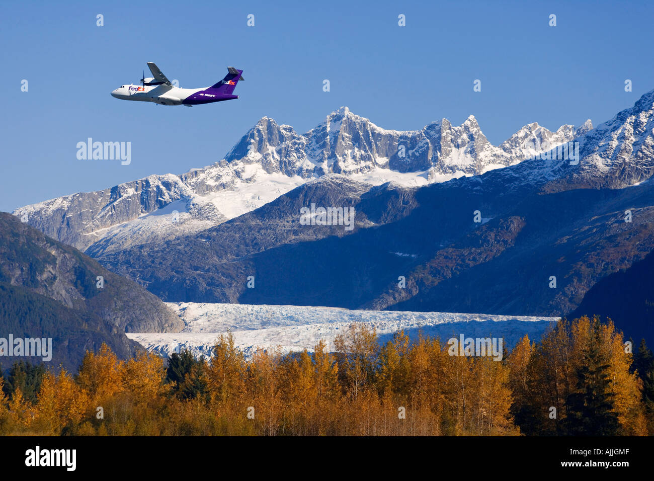 FedEx jet over Mendenhall Glacier Coast Mtns Southeast Alaska Composite ...