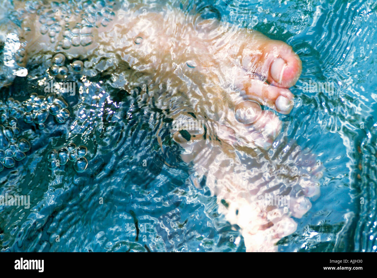Close up of a woman s feet submerged in water Stock Photo - Alamy