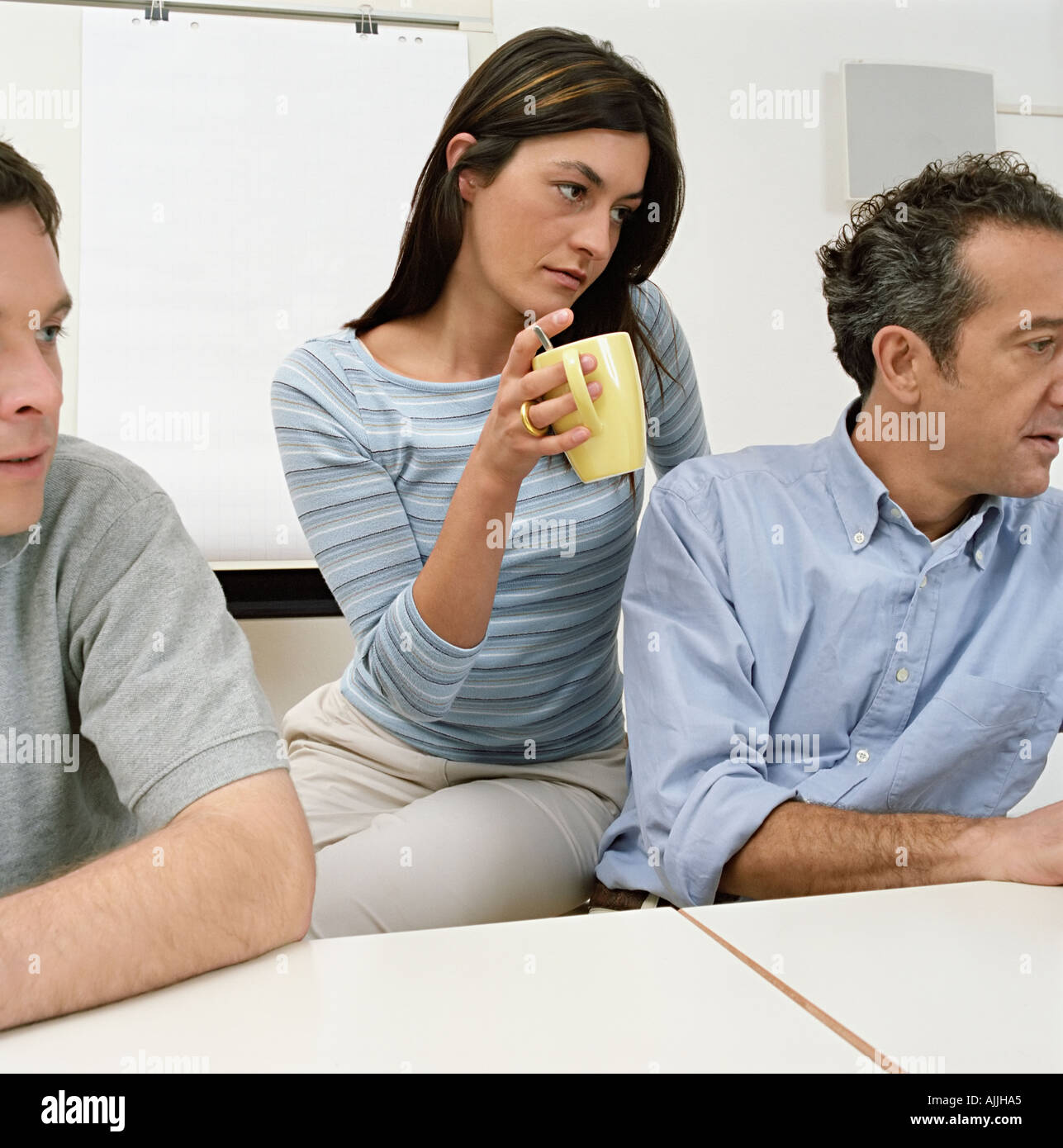 Three office workers Stock Photo - Alamy