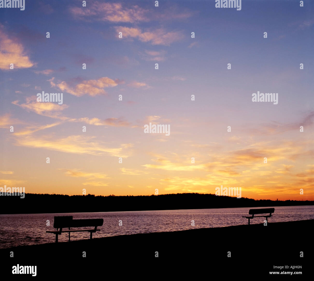 A lake scene at sunset Stock Photo - Alamy