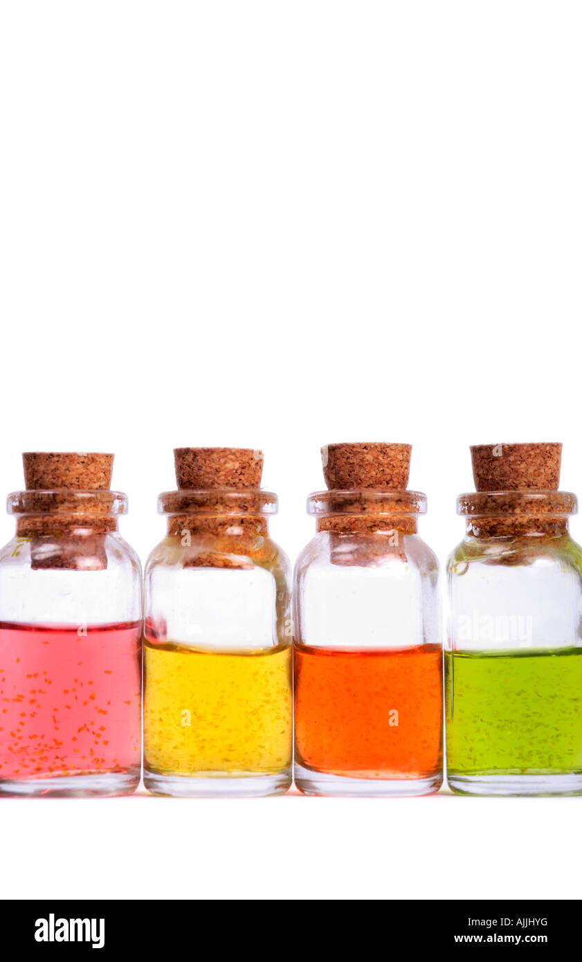 Coloured liquid in small glass jars Stock Photo - Alamy