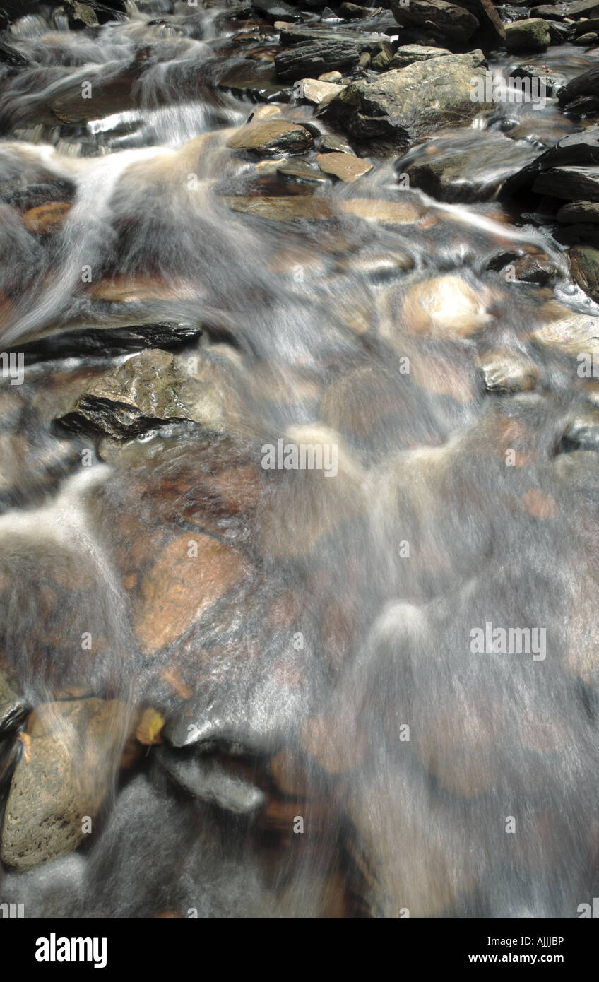 Water flowing over rocks in river Stock Photo - Alamy
