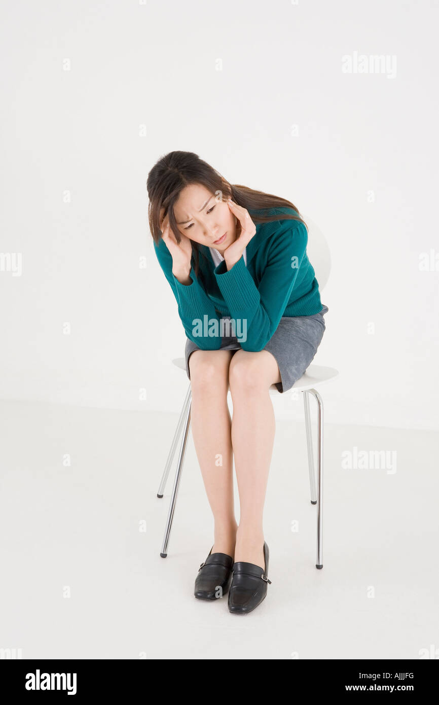 Worried young woman Stock Photo - Alamy