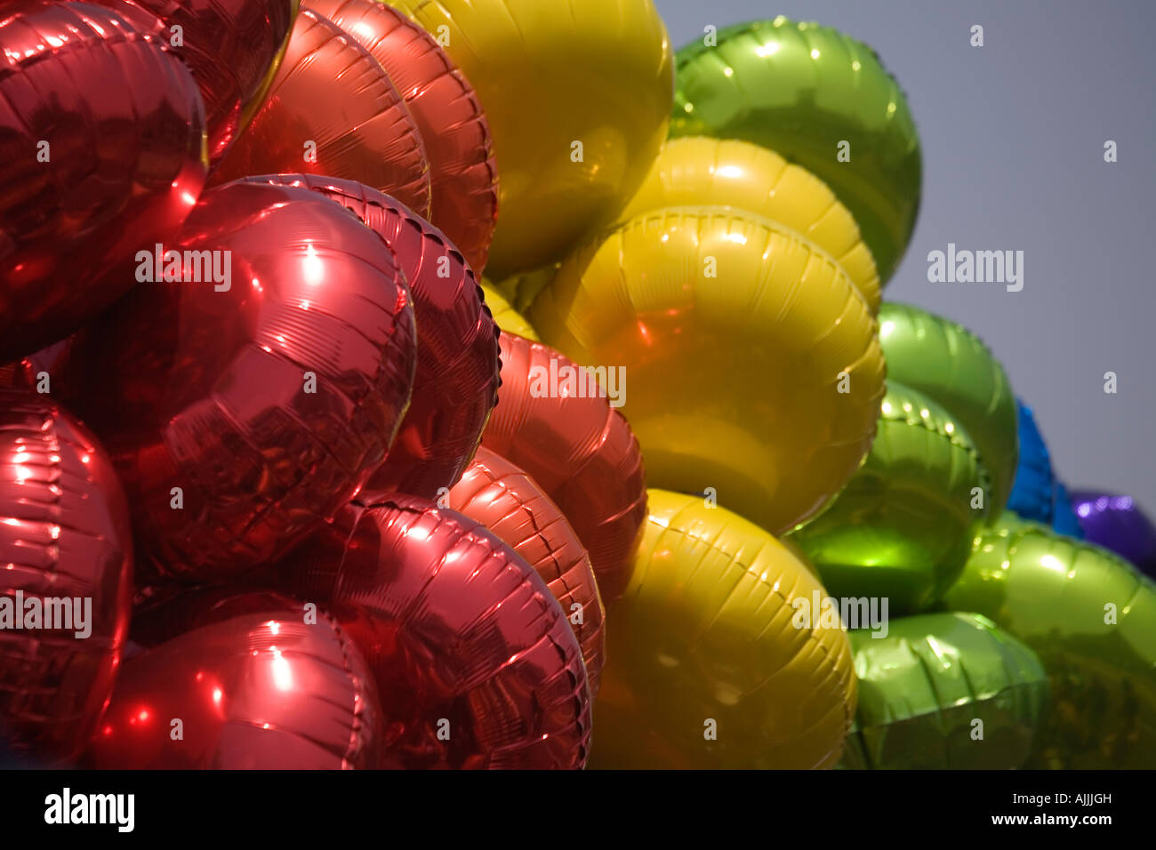 A bunch of rainbow colored, helium filled balloons Stock Photo - Alamy