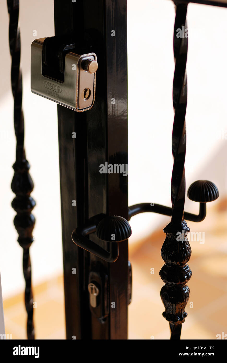 BLACK ORNATE GRILLS WITH ADDITIONAL SAFETY PADLOCK ON HOME IN SPAIN ...