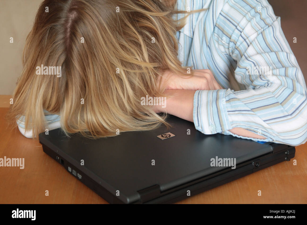 Slumped at desk hi-res stock photography and images - Alamy