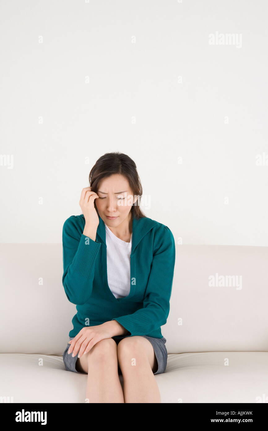 Worried young woman Stock Photo - Alamy