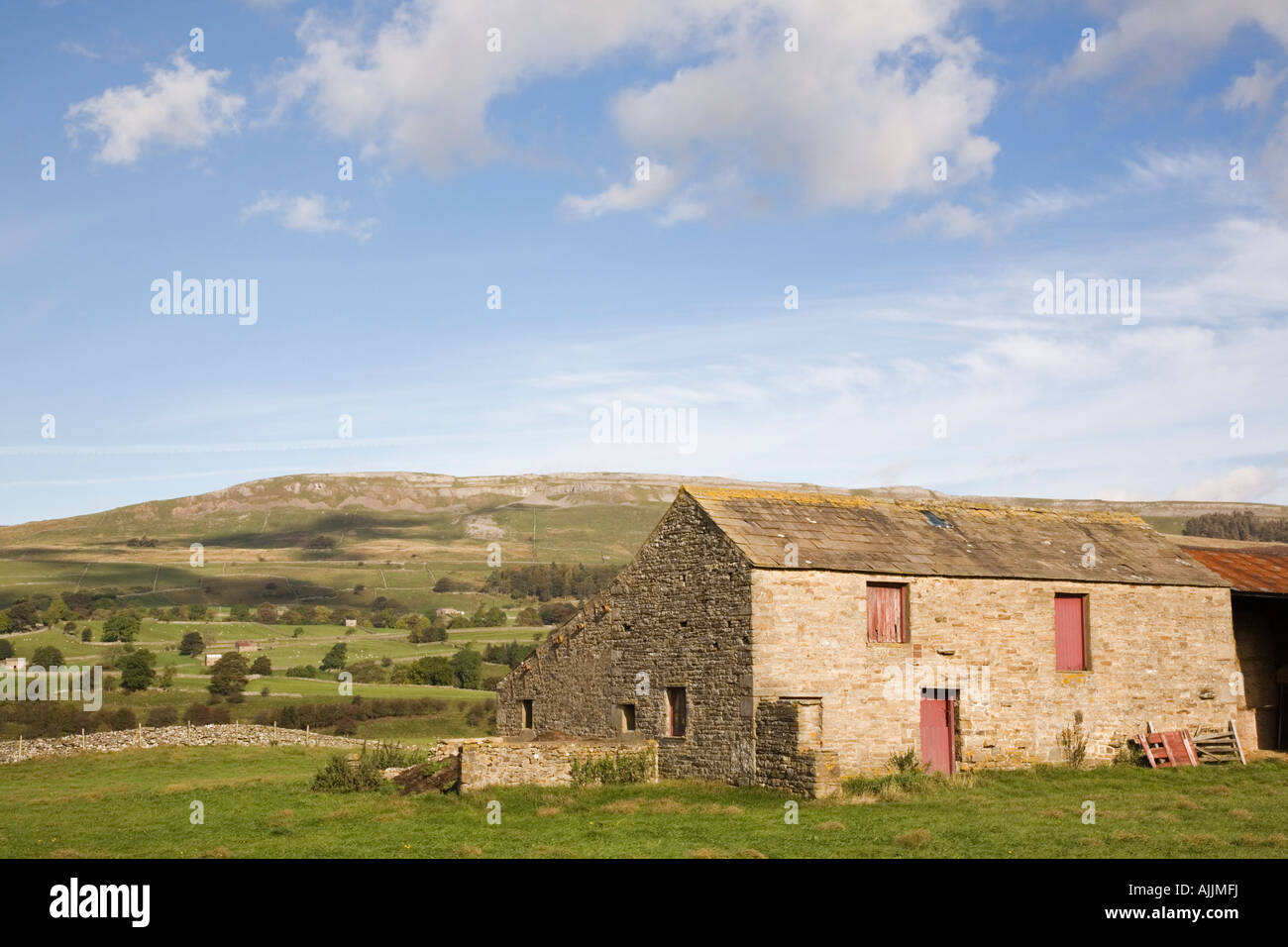Traditional stone Barn in rural farmland landscape in Pennine valley in ...