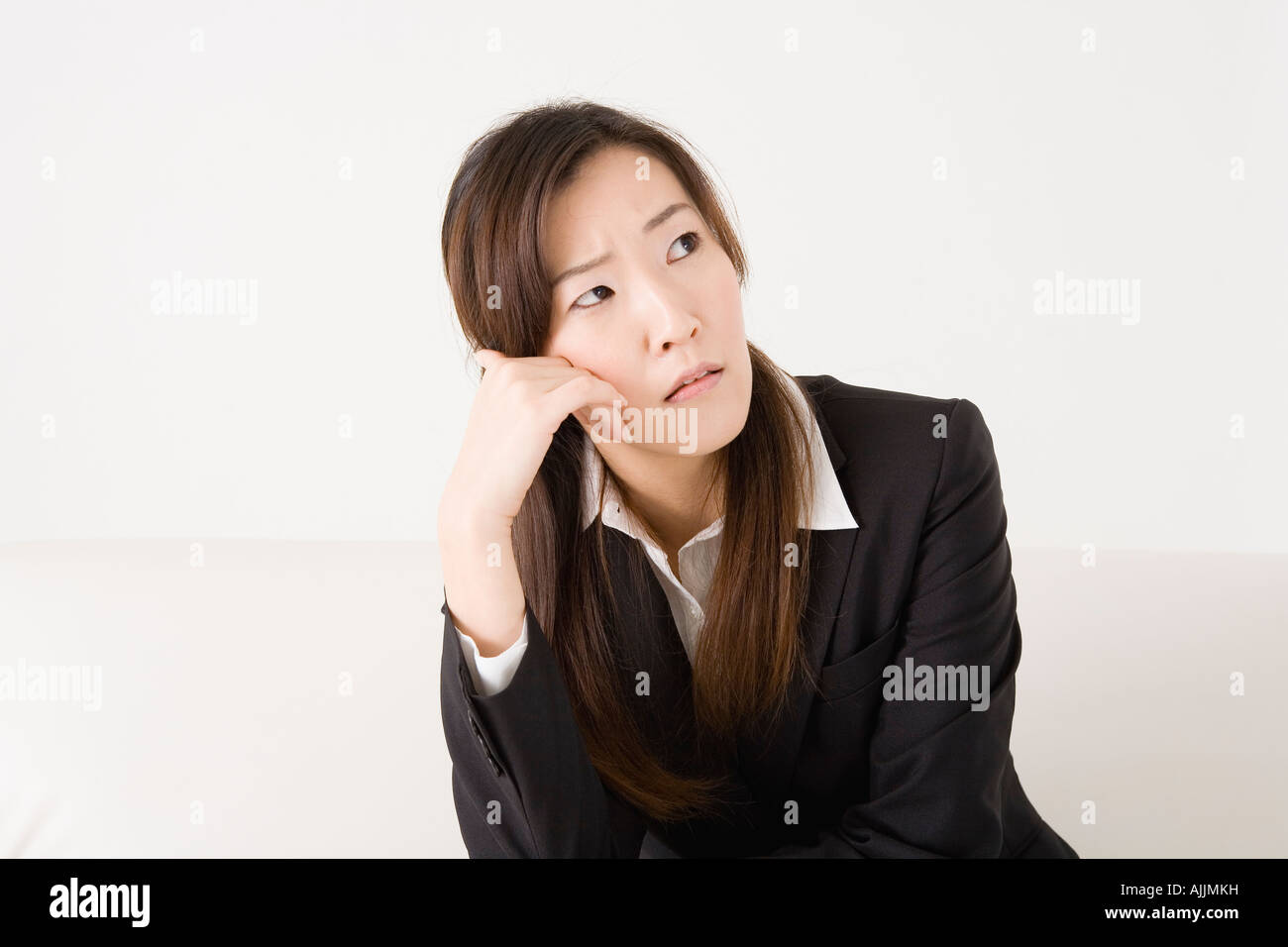 Worried young woman Stock Photo - Alamy