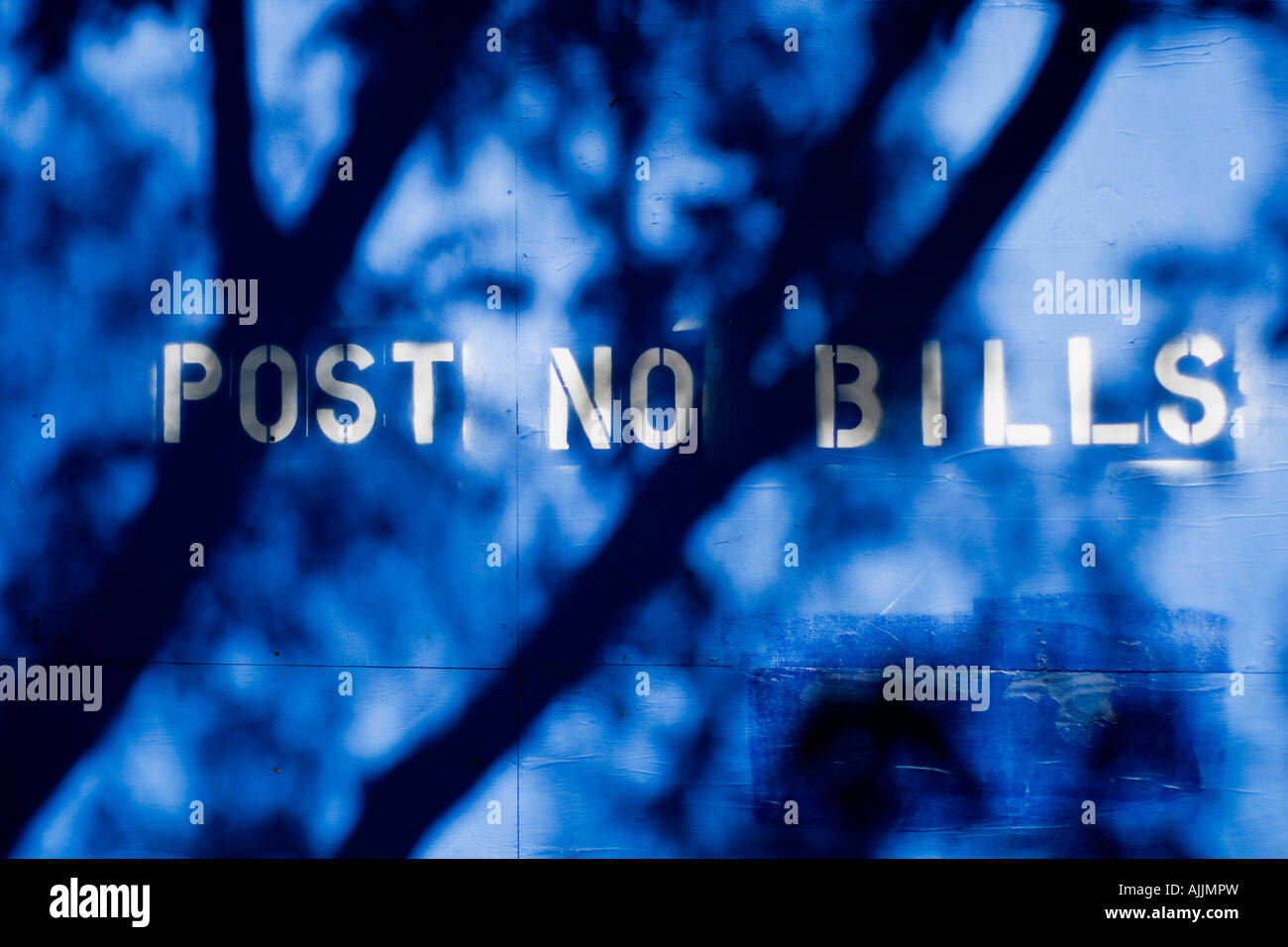 post no bills sign on blue wall Stock Photo - Alamy