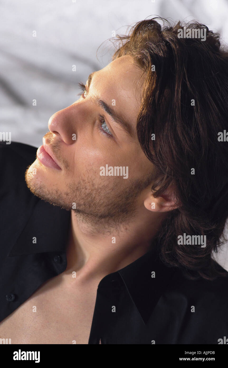 Side profile of a young man looking sideways Stock Photo - Alamy