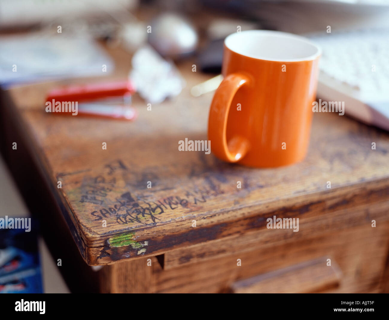 Graffiti and coffee cup on desk Stock Photo - Alamy
