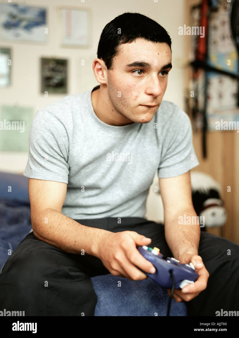 Boy playing a video game Stock Photo - Alamy