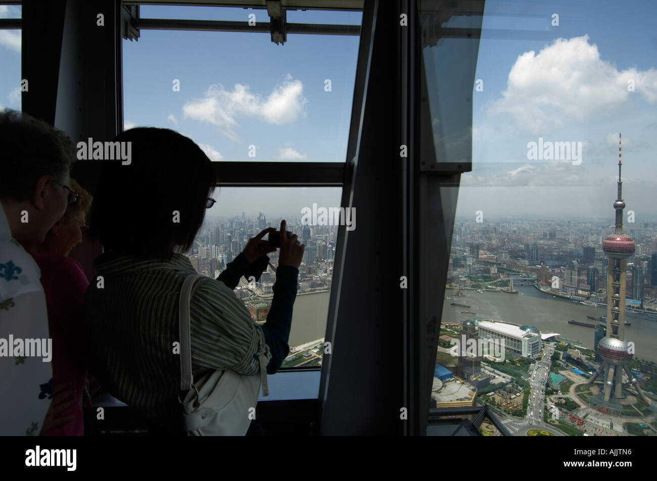 Taking of Pudong New Area and Puxi Area Skyline inside of the Jin Mao ...