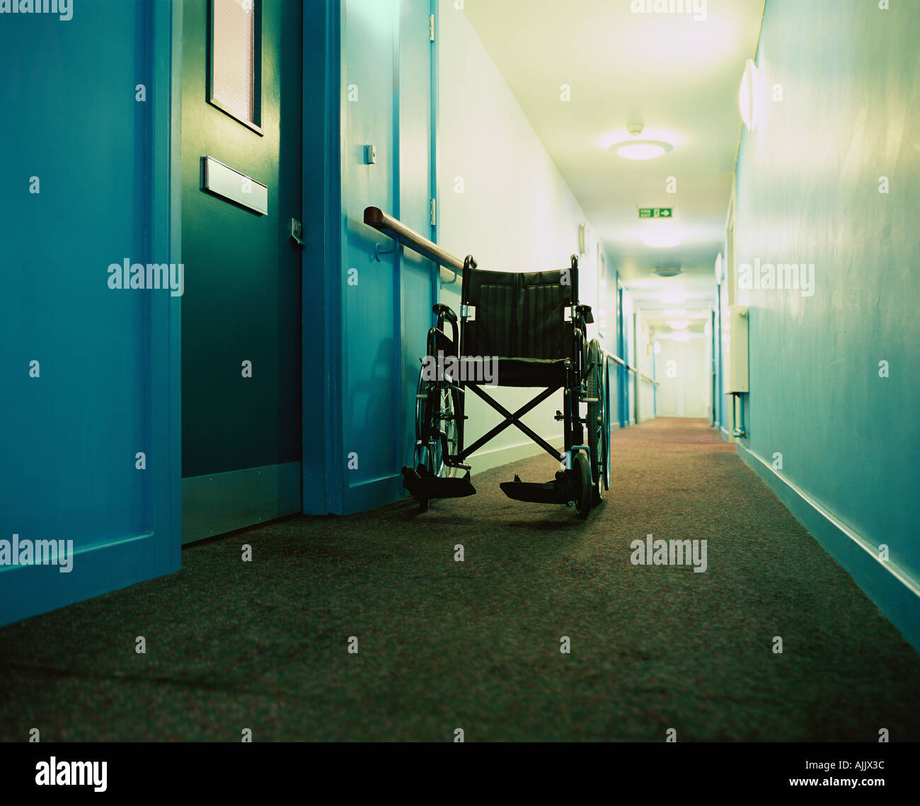 Wheelchair in a corridor Stock Photo - Alamy