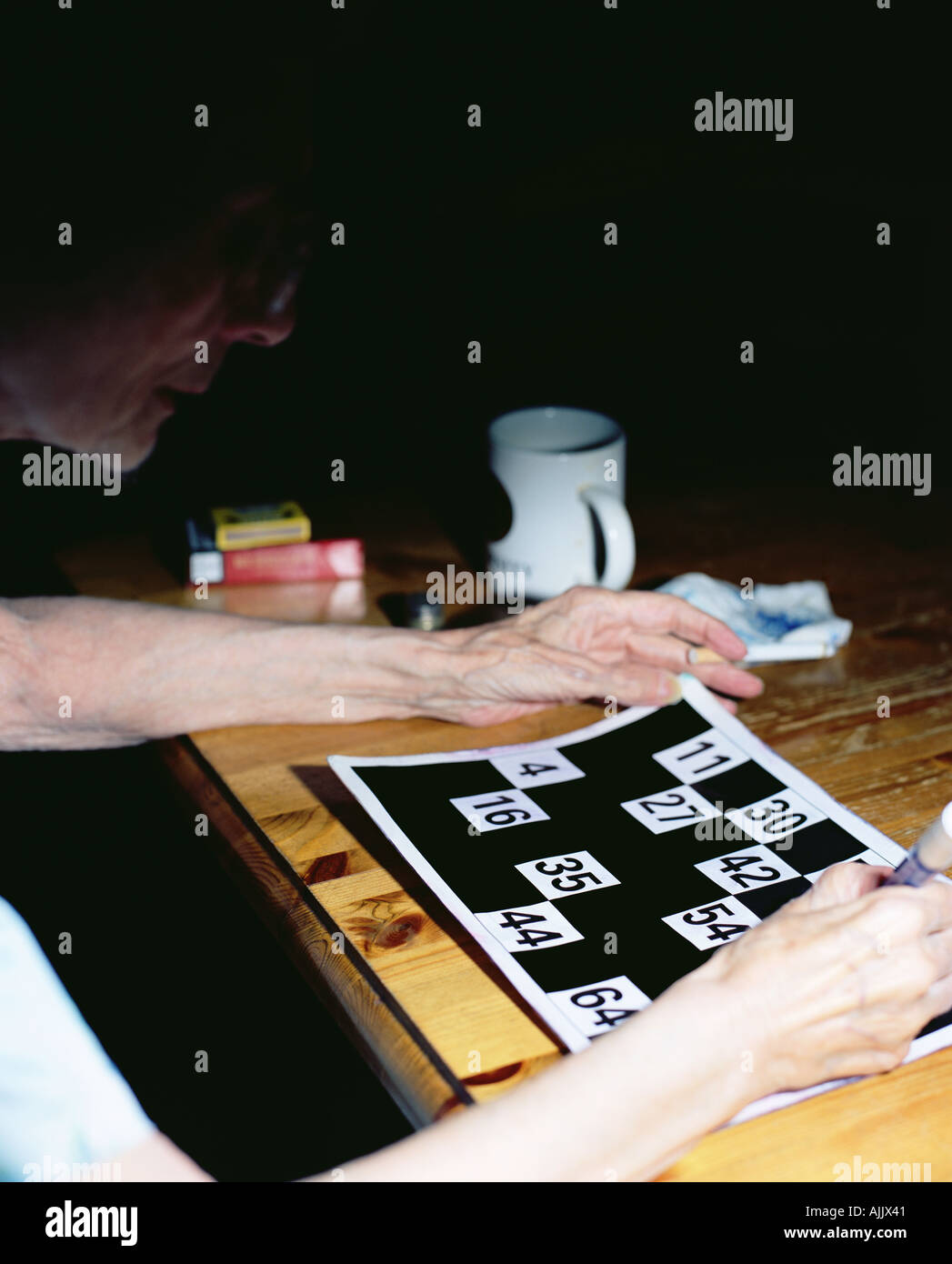 Woman playing bingo Stock Photo - Alamy