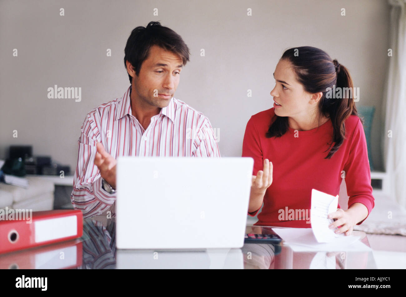 Man and woman arguing over paperwork hi-res stock photography and ...
